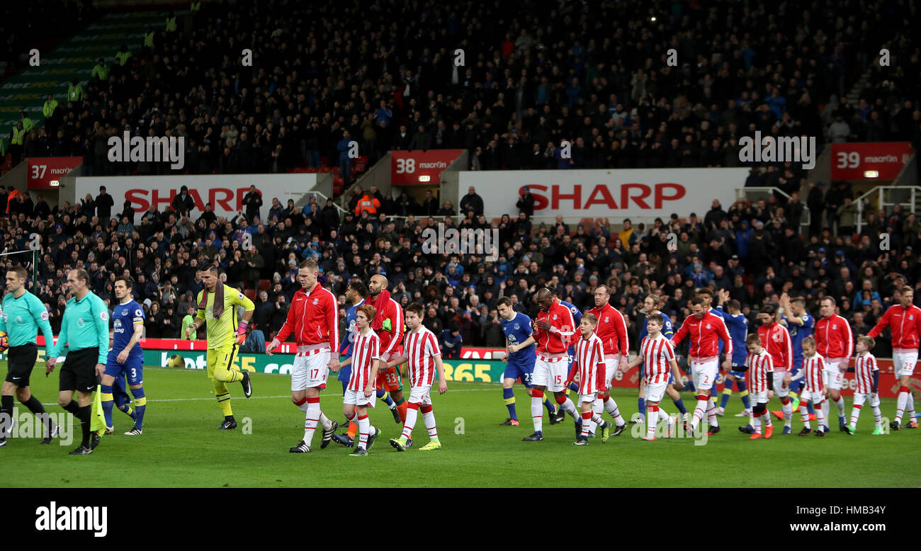 The two teams walk out before kick-off during the Premier League match ...