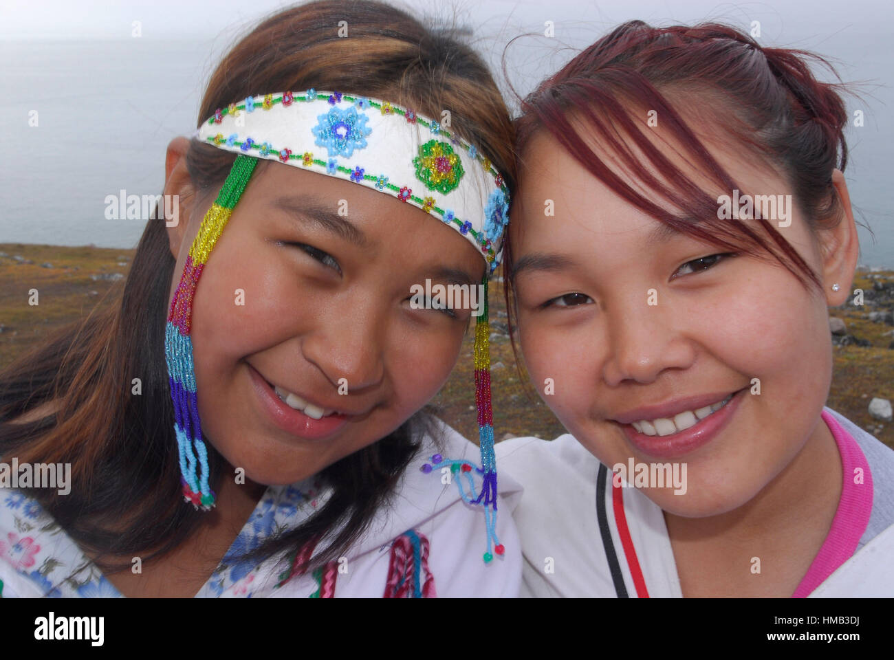 Model released inuit teens throat singing, wearing their traditional ...