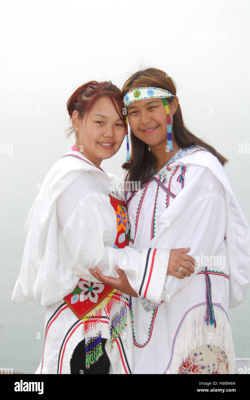 Model released inuit teens throat singing, wearing their traditional ...