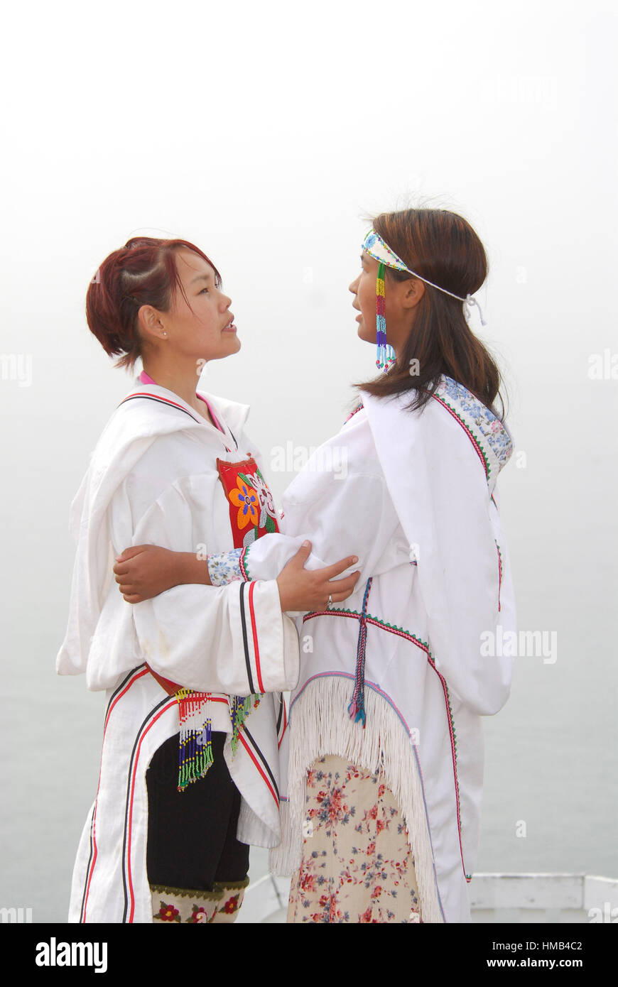 Model released inuit teens throat singing, wearing their traditional ...