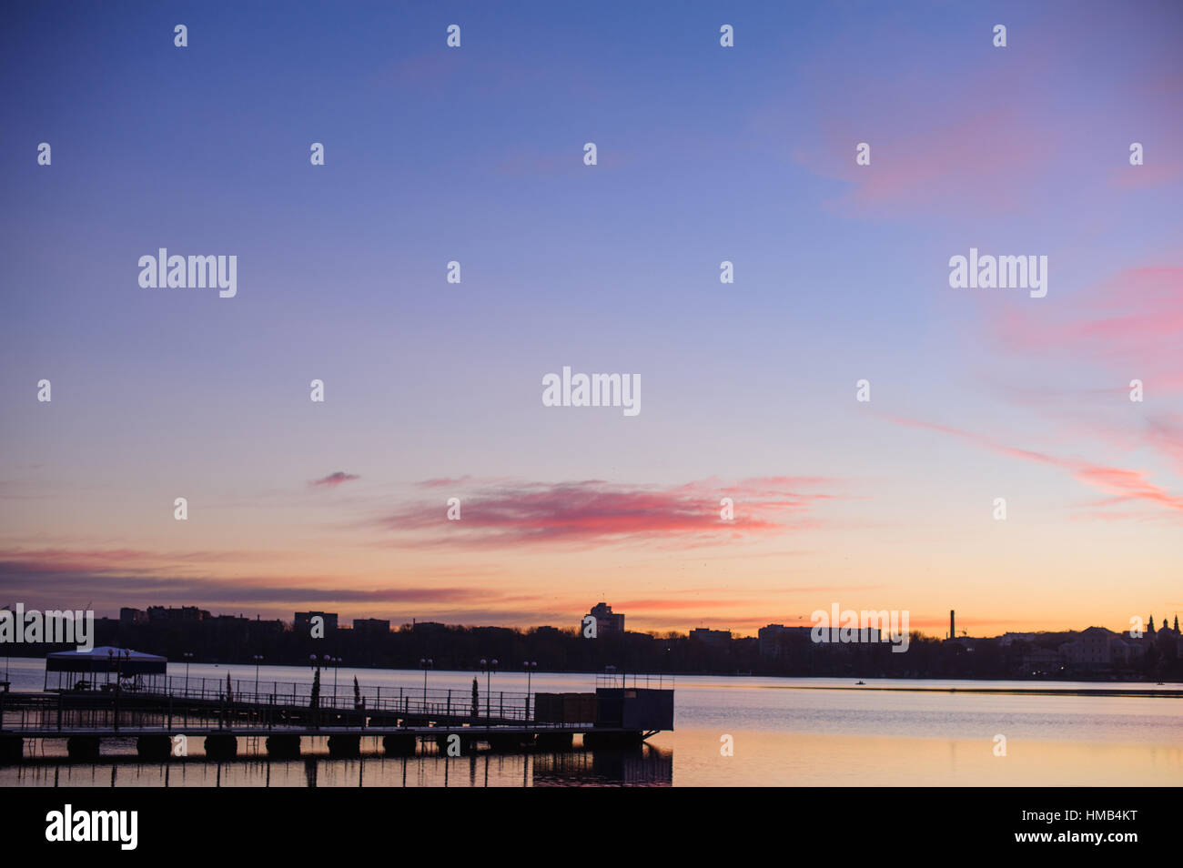 Pier at sunset Stock Photo - Alamy