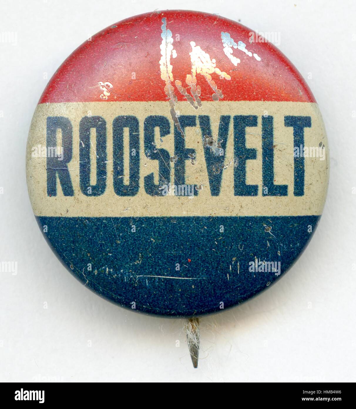 Pinback button with red, white and blue coloration and lettering ...