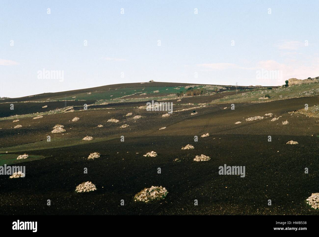 Piles of stones and rocks in ploughed fields near Piana degli Albanesi ...