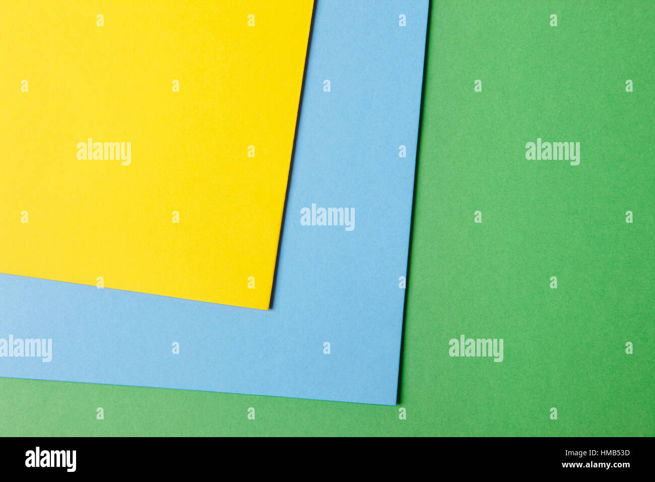 Colored cardboards background in yellow blue green tone. Copy space ...