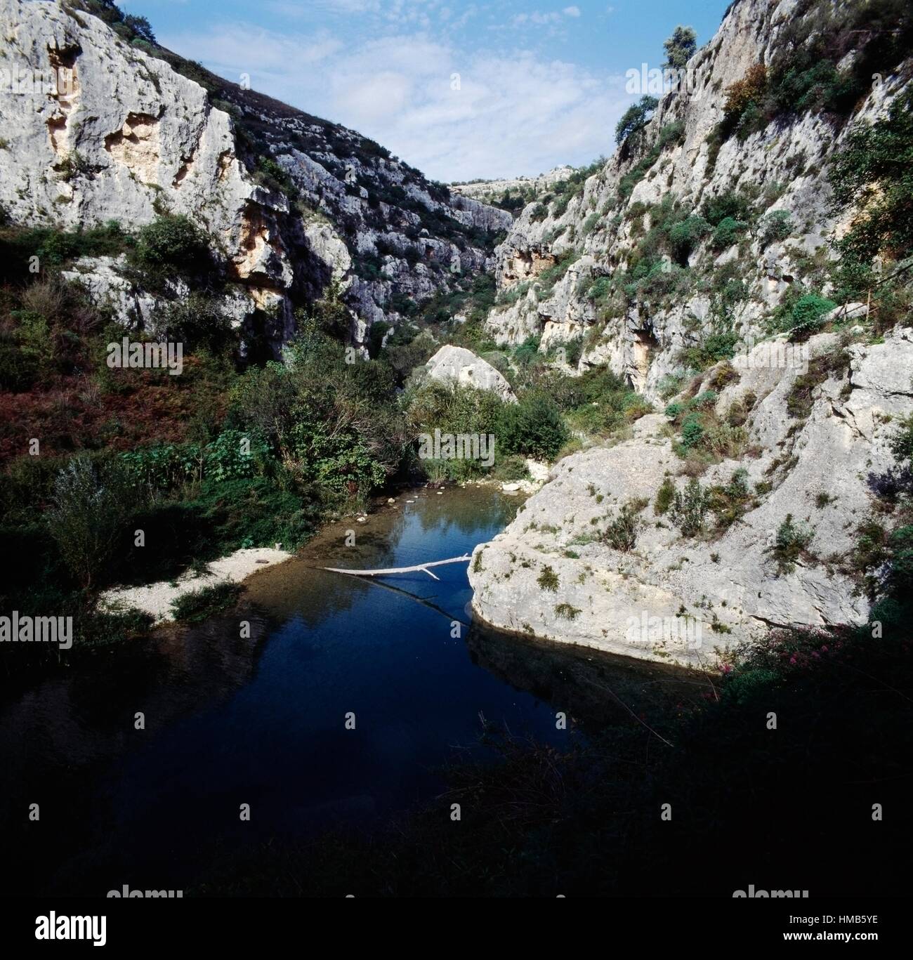 A waterway between the rocks near the Rocky Necropolis of Pantalica ...