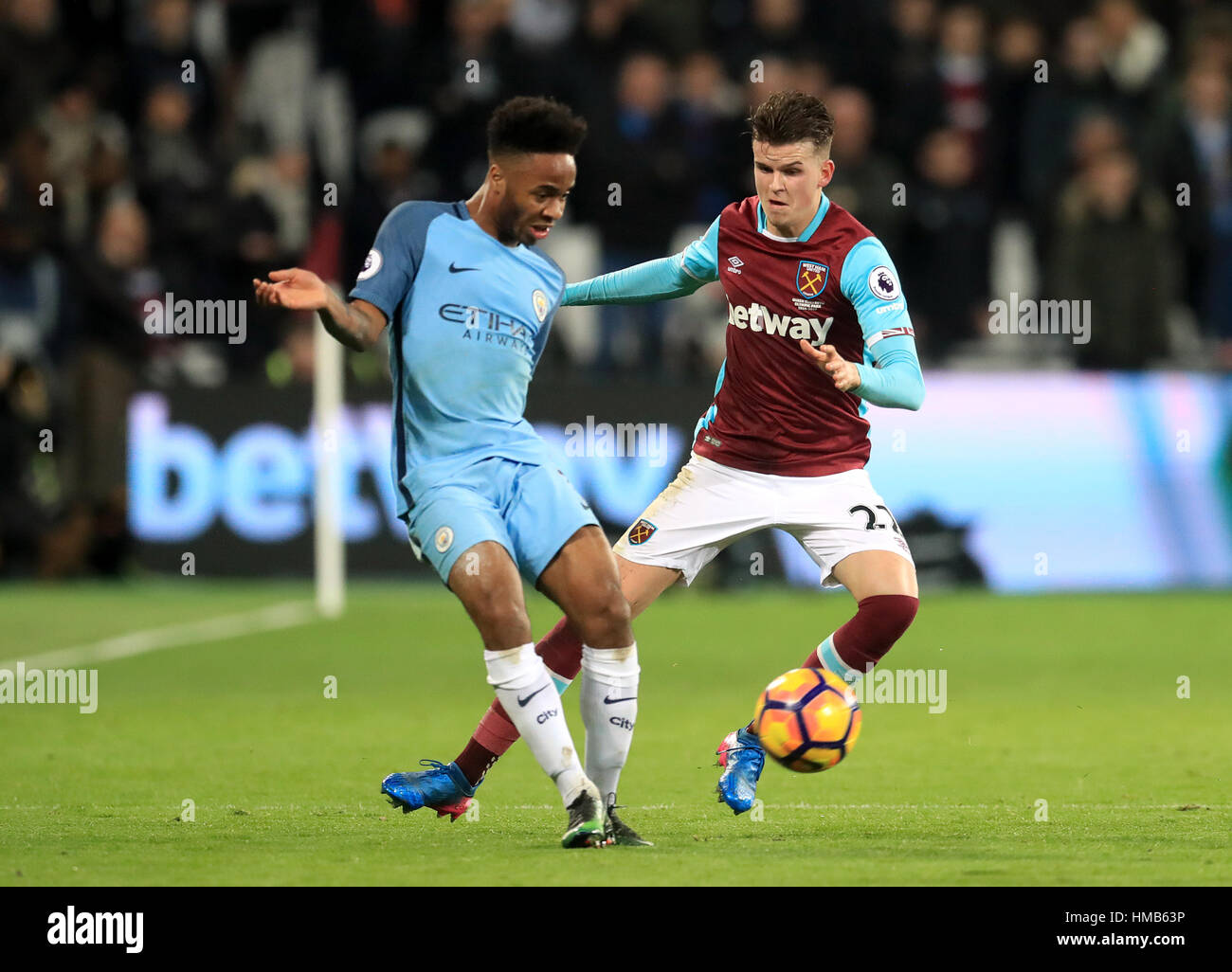 Manchester City's Raheem Sterling (left) and West Ham United's Sam ...