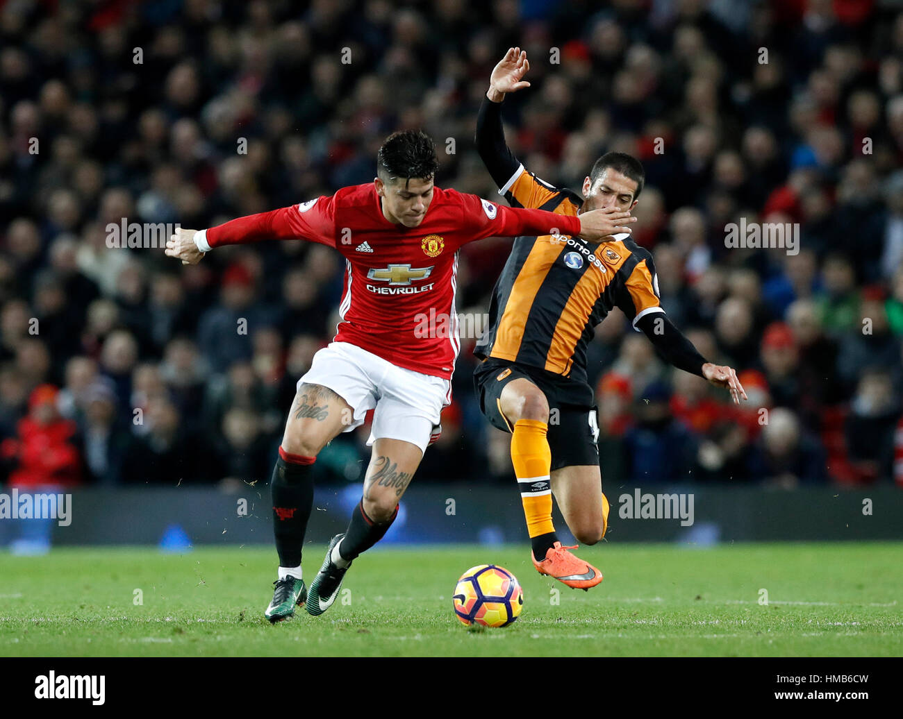 Manchester United's Marcos Rojo (left) and Hull City's Goebel Evandro ...