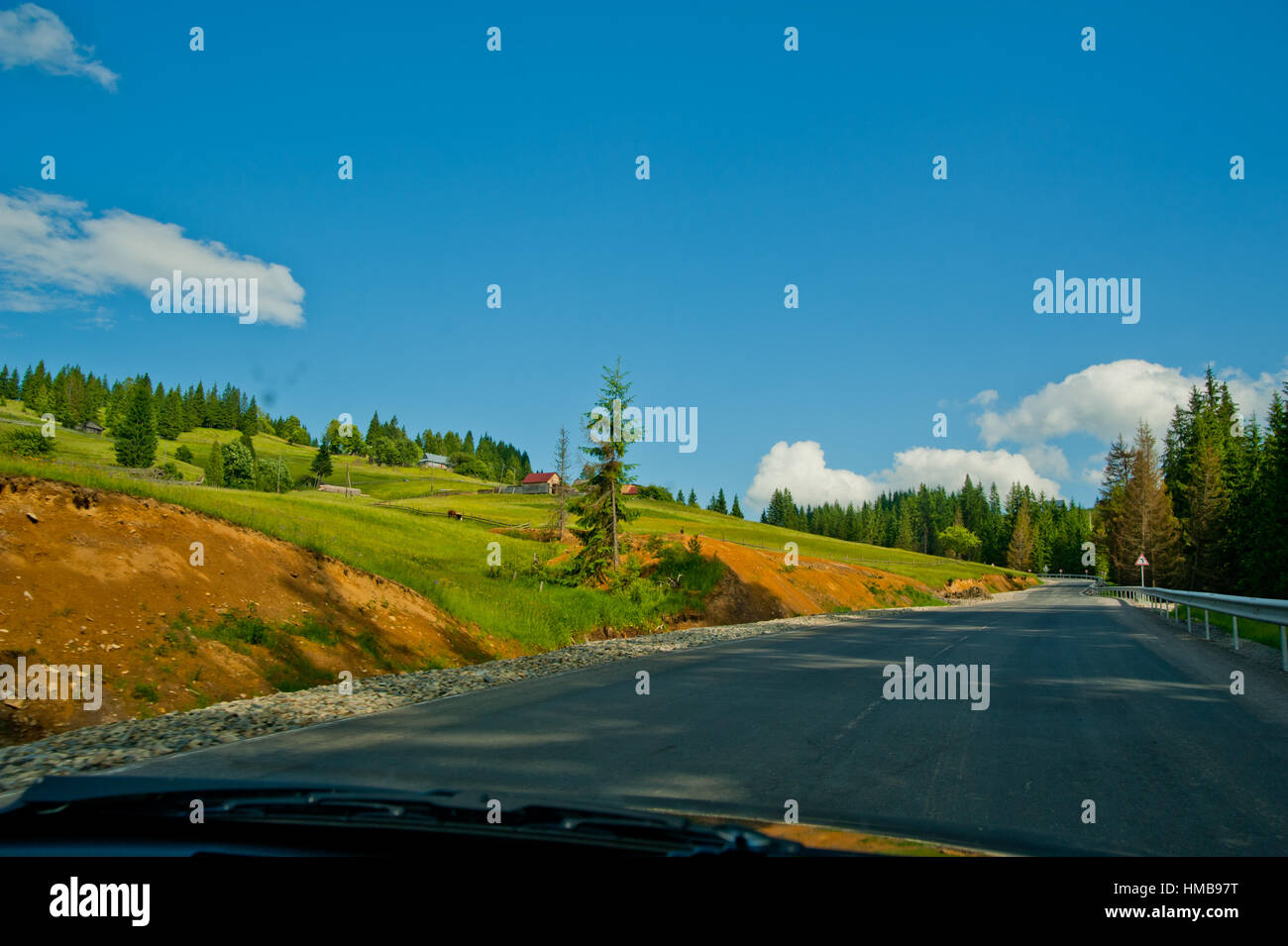 Empty curved road Stock Photo - Alamy