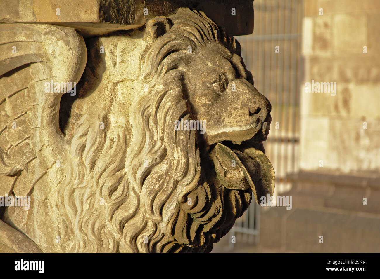 Stone sculpture of a lion sticking out it`s tongue, part of a fountain ...