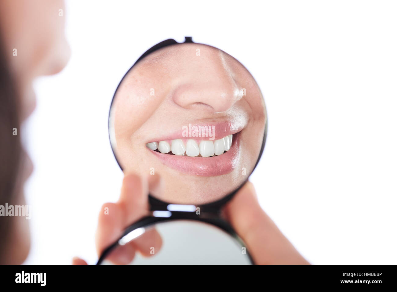 reflection on mirror of a girl's smile on a white background Stock ...