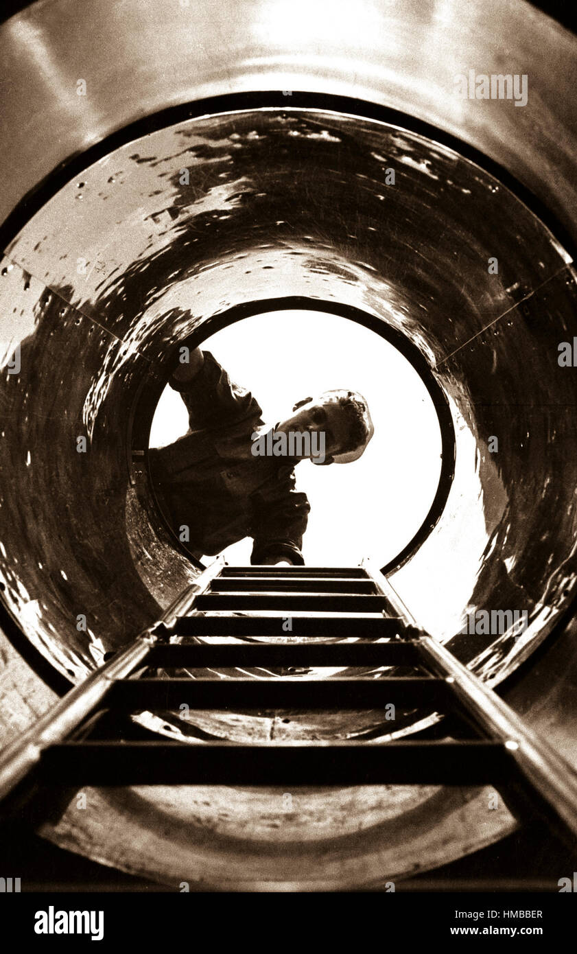On board the USS MARLIN at New London, Conn. Sailor looks down the ...