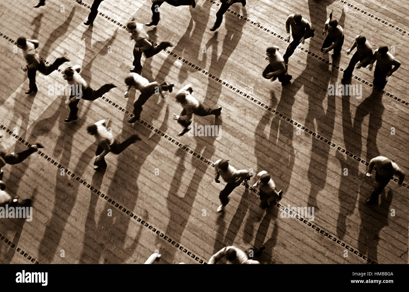 Crewmen aboard USS YORKTOWN dash to stations as general quarters sound ...