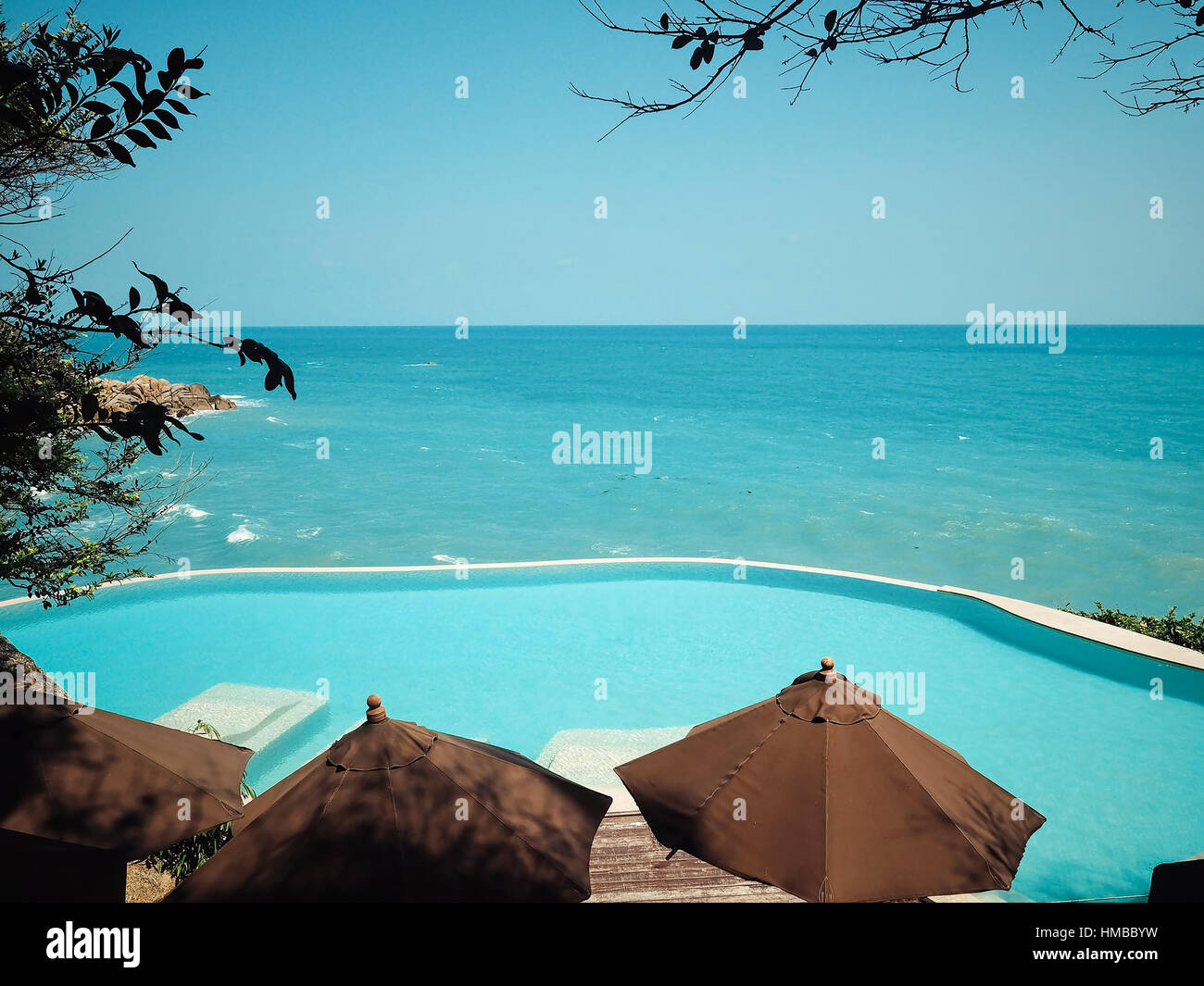 Cafe and swimming pool at a tropical beach Stock Photo - Alamy