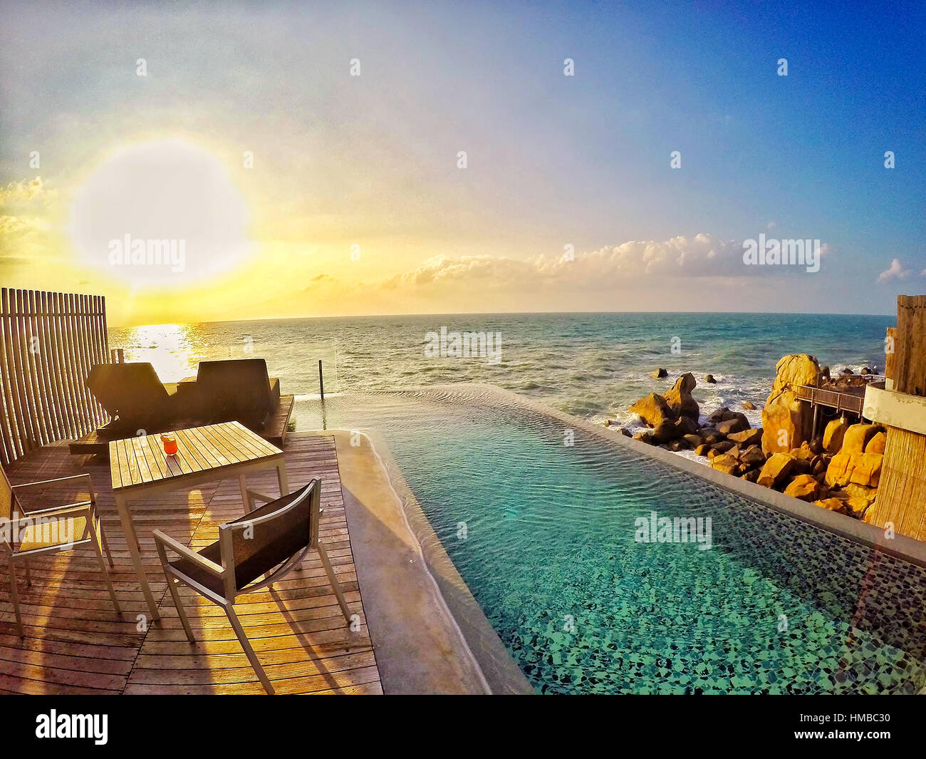 Cafe and swimming pool at a tropical beach Stock Photo - Alamy