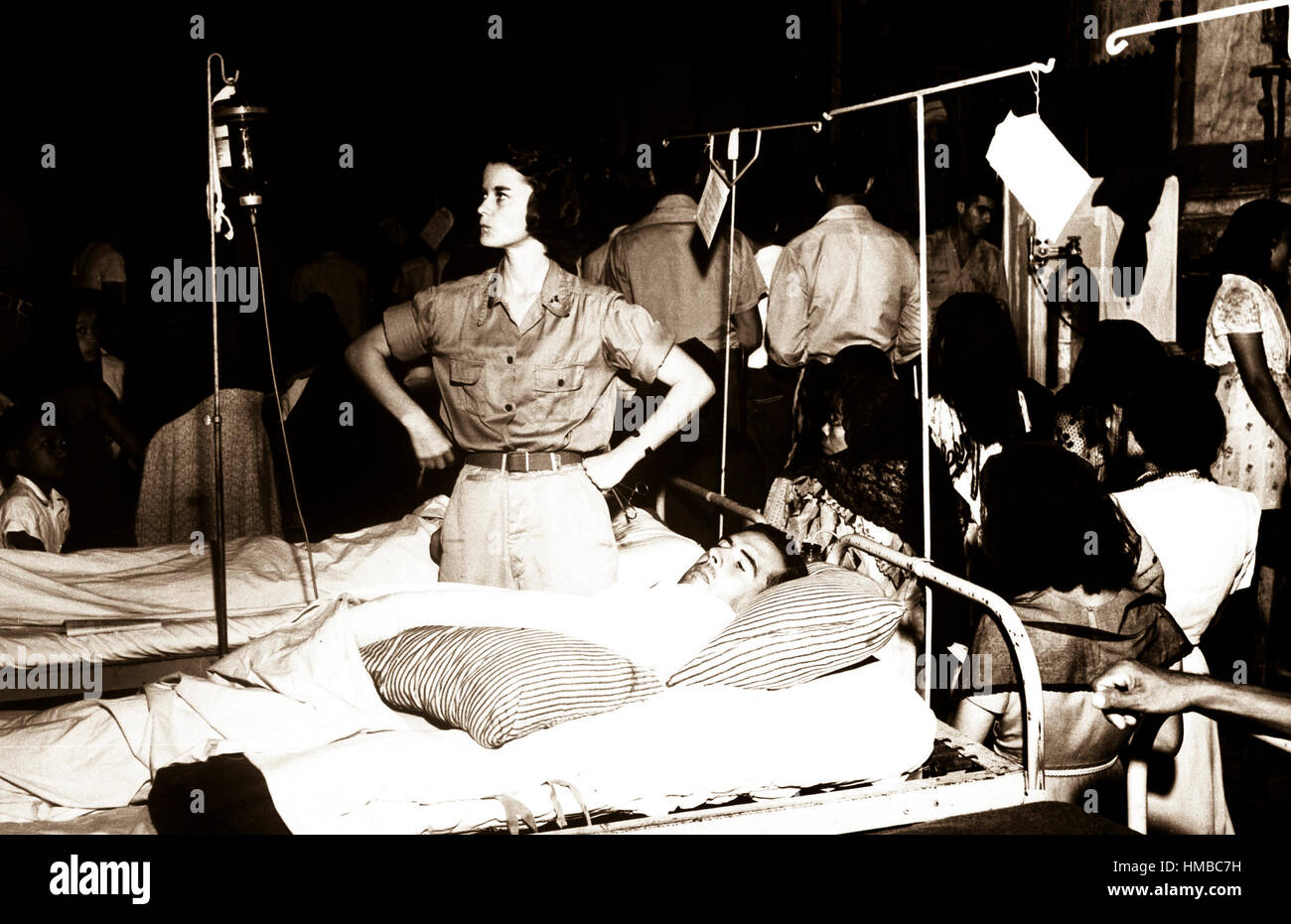 1st Lt. Phyllis Hocking adjusts glucose injection apparatus for a GI ...