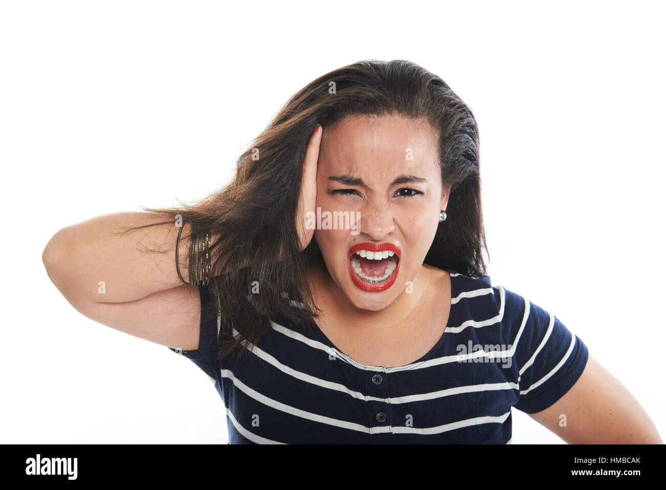 girl shouting out load with pain on a white background Stock Photo - Alamy