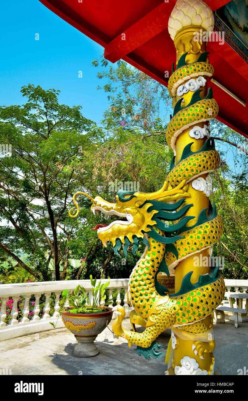 Chinese style dragon statue wrapped around red pole and art Chinese ...