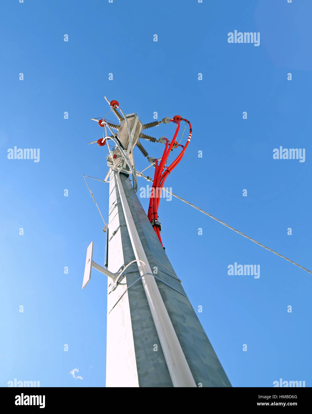 big pole of an electrical system with cables and high voltage ...