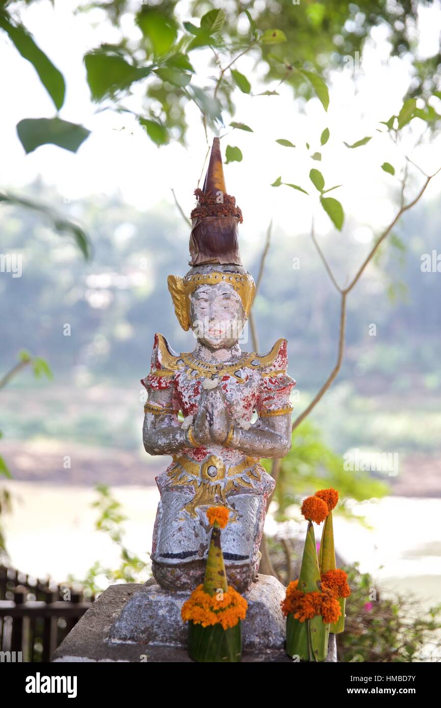 Wooden praying statue Stock Photo - Alamy
