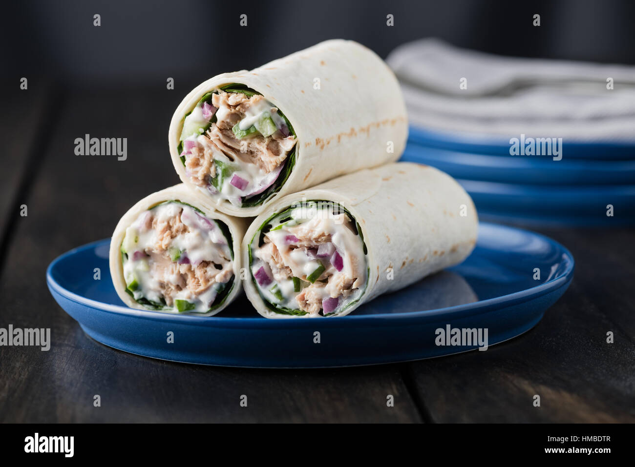 Tuna burritos with cucumber red onion and mayonnaise on rustic ...