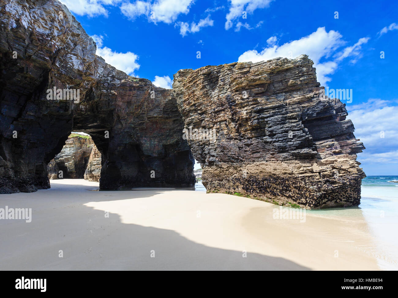 Natural rock arches on Cathedrals beach in low tide (Cantabric coast ...
