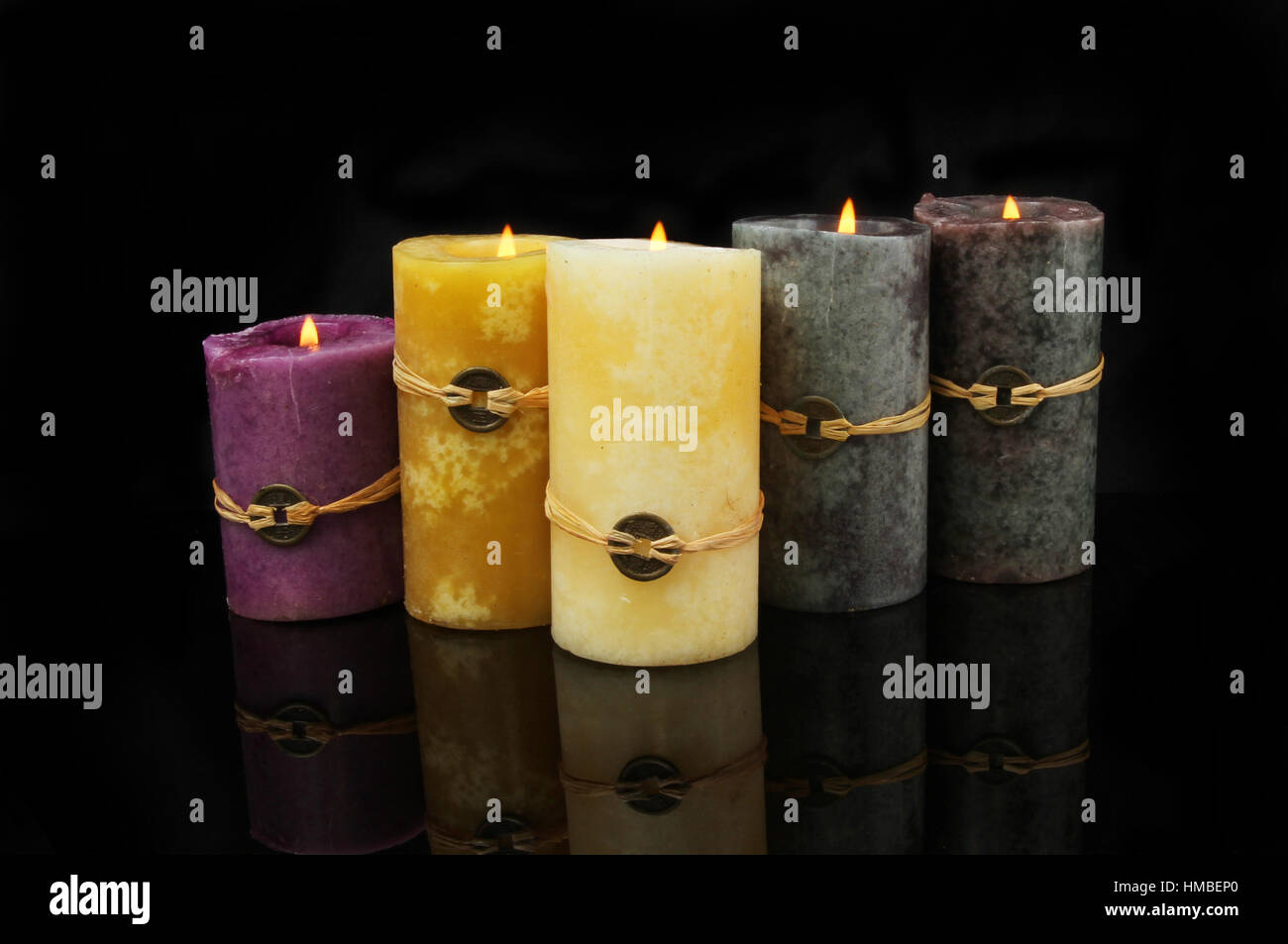 Group of burning five Feng Shui candles representing Metal, Earth, Wood ...