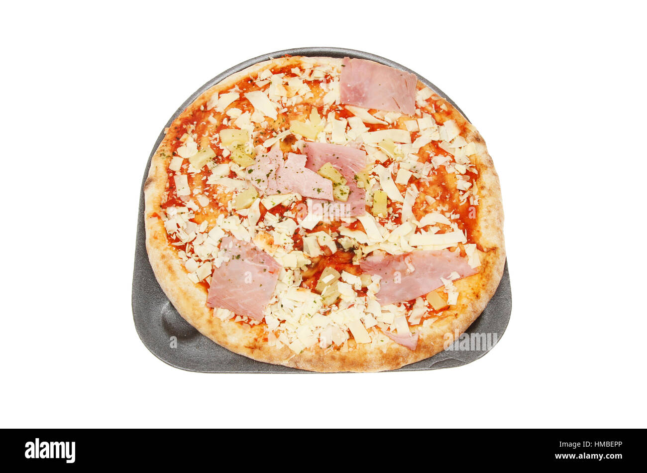 Uncooked ham and pineapple pizza in packaging isolated against white ...