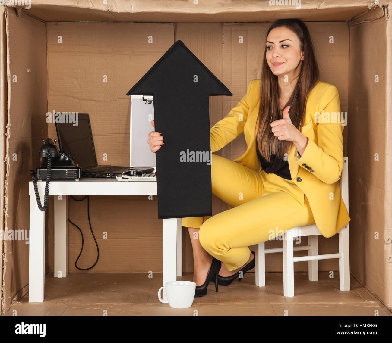 Smiling business woman enjoys the increase in goodwill Stock Photo - Alamy