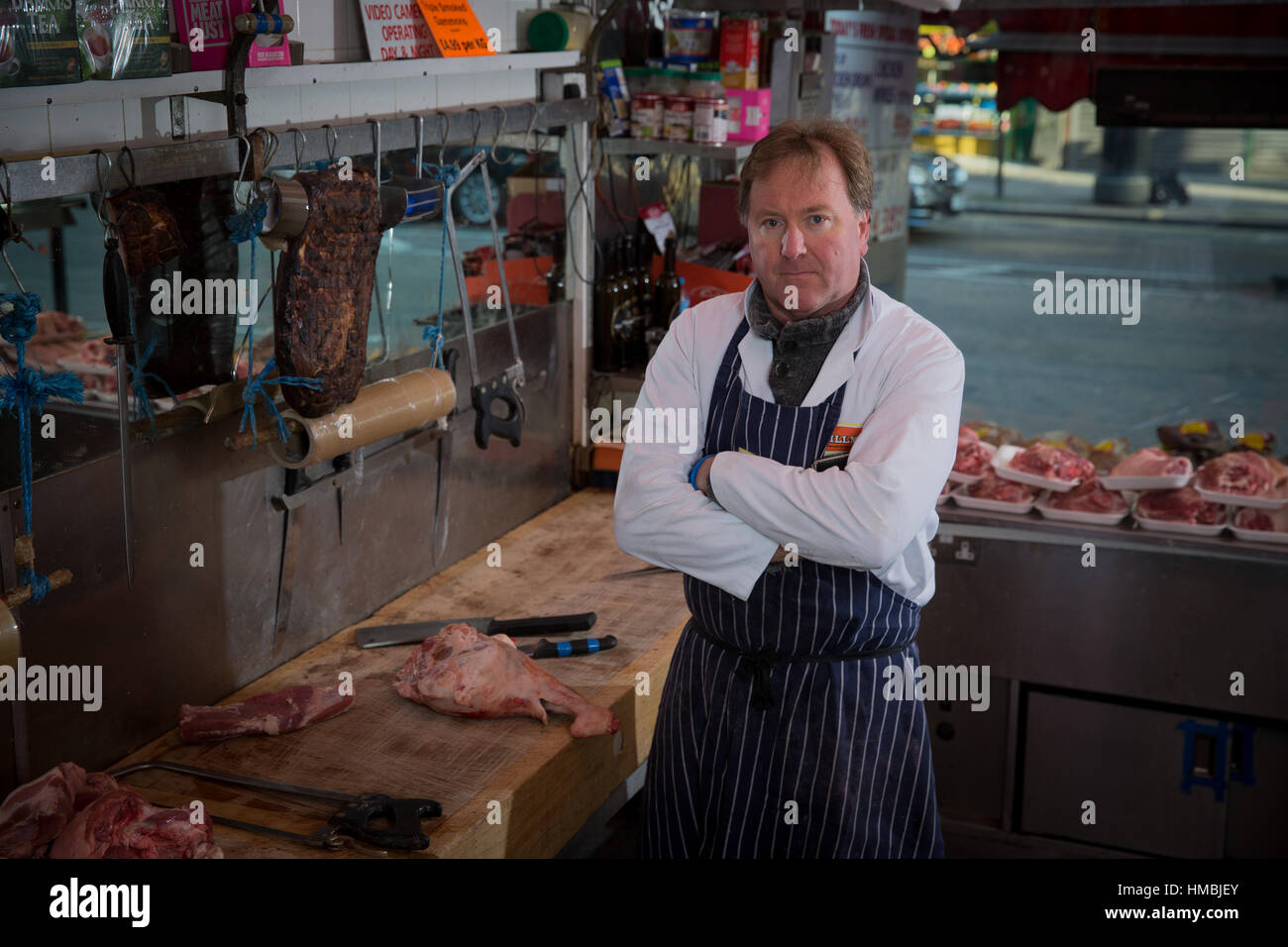 Butchers pose outside their butcher shop in London Stock Photo - Alamy