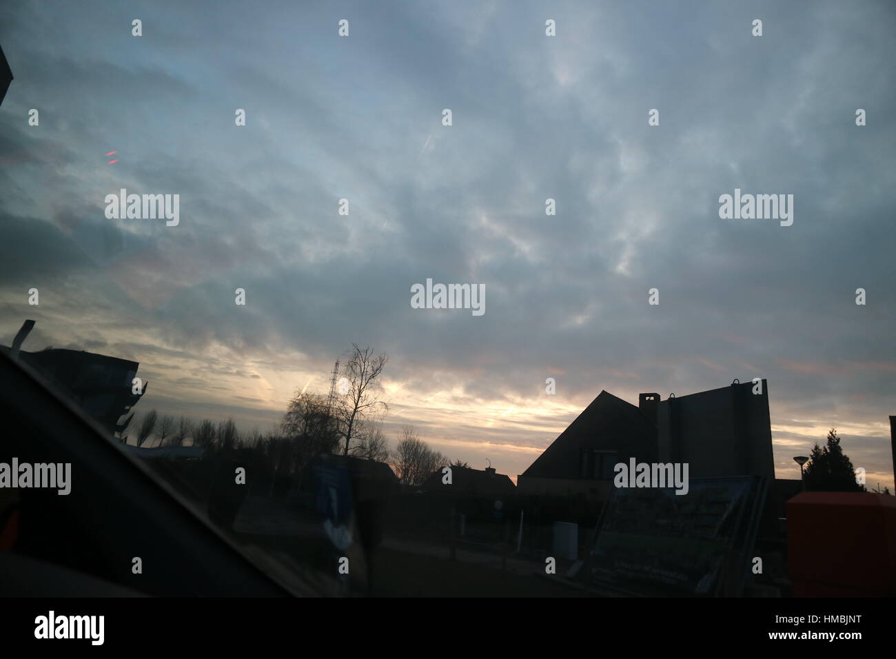 sunset with vaportrails Stock Photo - Alamy