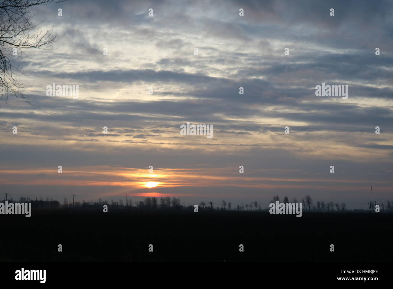 Sunrise sunset distance over the horizon Stock Photo - Alamy