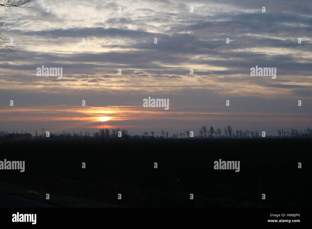 Sunrise sunset distance over the horizon Stock Photo - Alamy