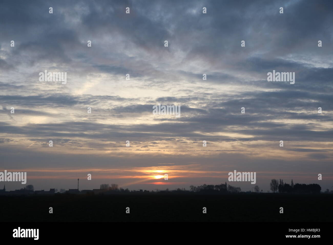 Sunrise sunset distance over the horizon Stock Photo - Alamy