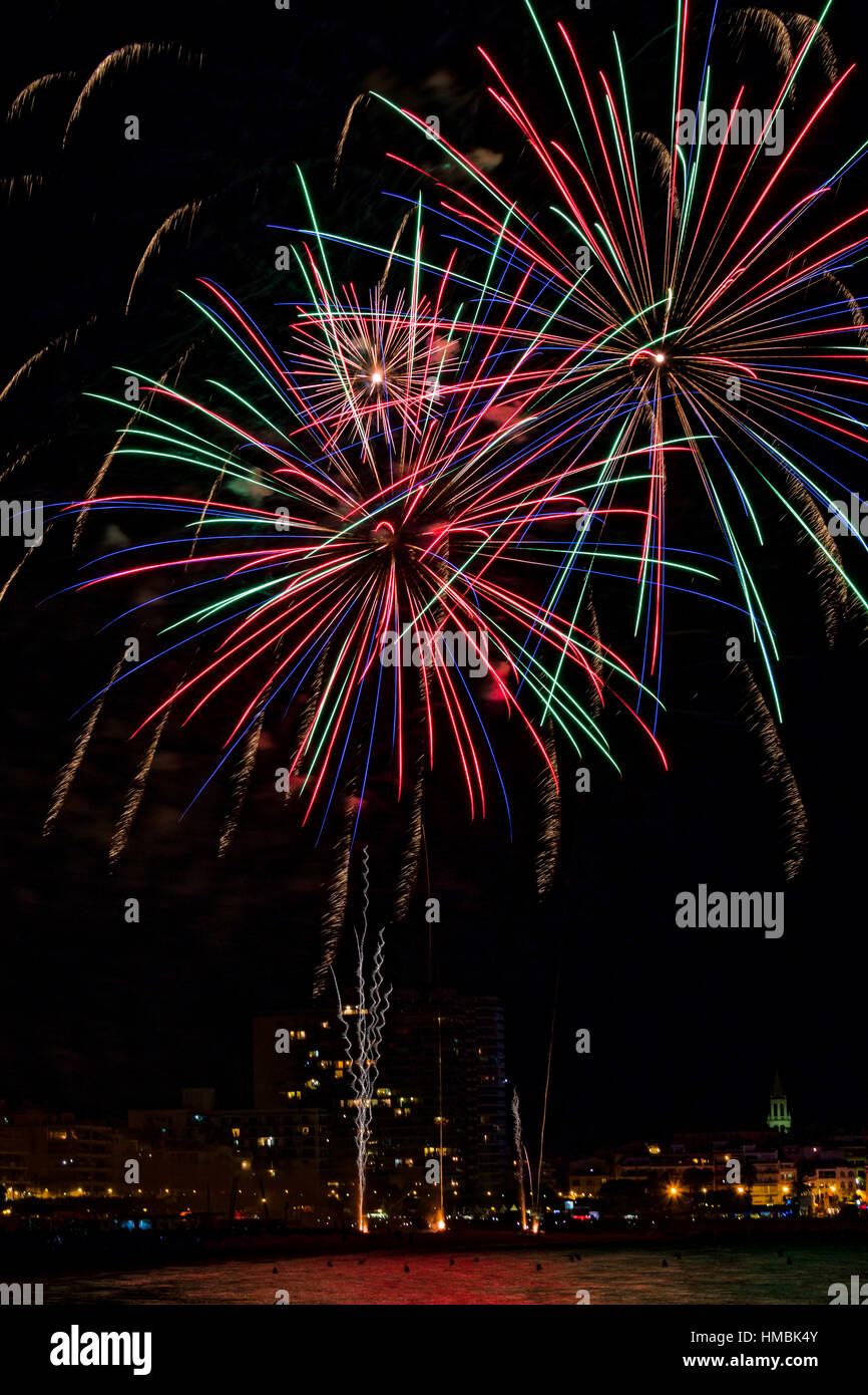 Interesting fireworks over the small town in Spain, Palamos Stock Photo ...