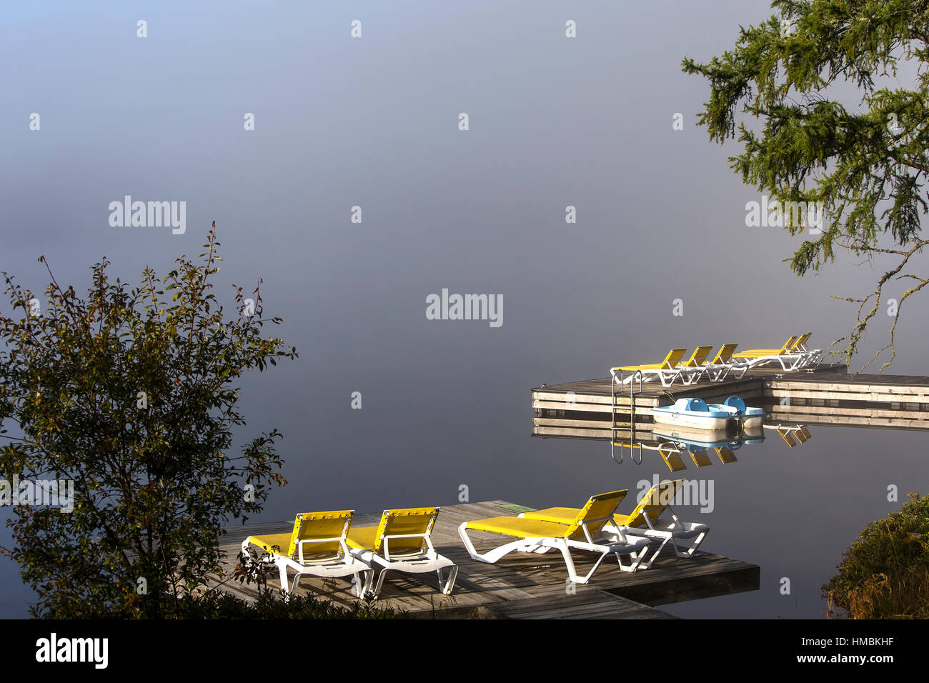 view of a boat dock the Lac-Superieur, misty morning with fog, in ...