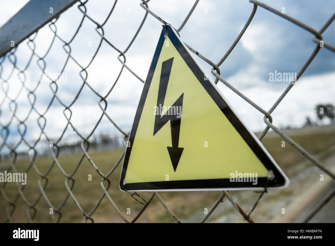 high voltage warning sign on high-voltage substation Stock Photo - Alamy