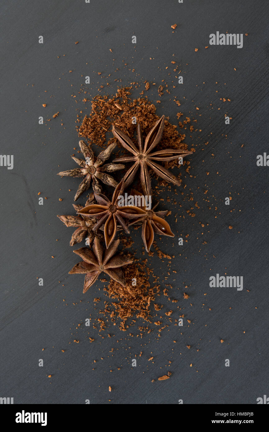 Close Up of Ground and Whole Star Anise on chalkboard background Stock ...