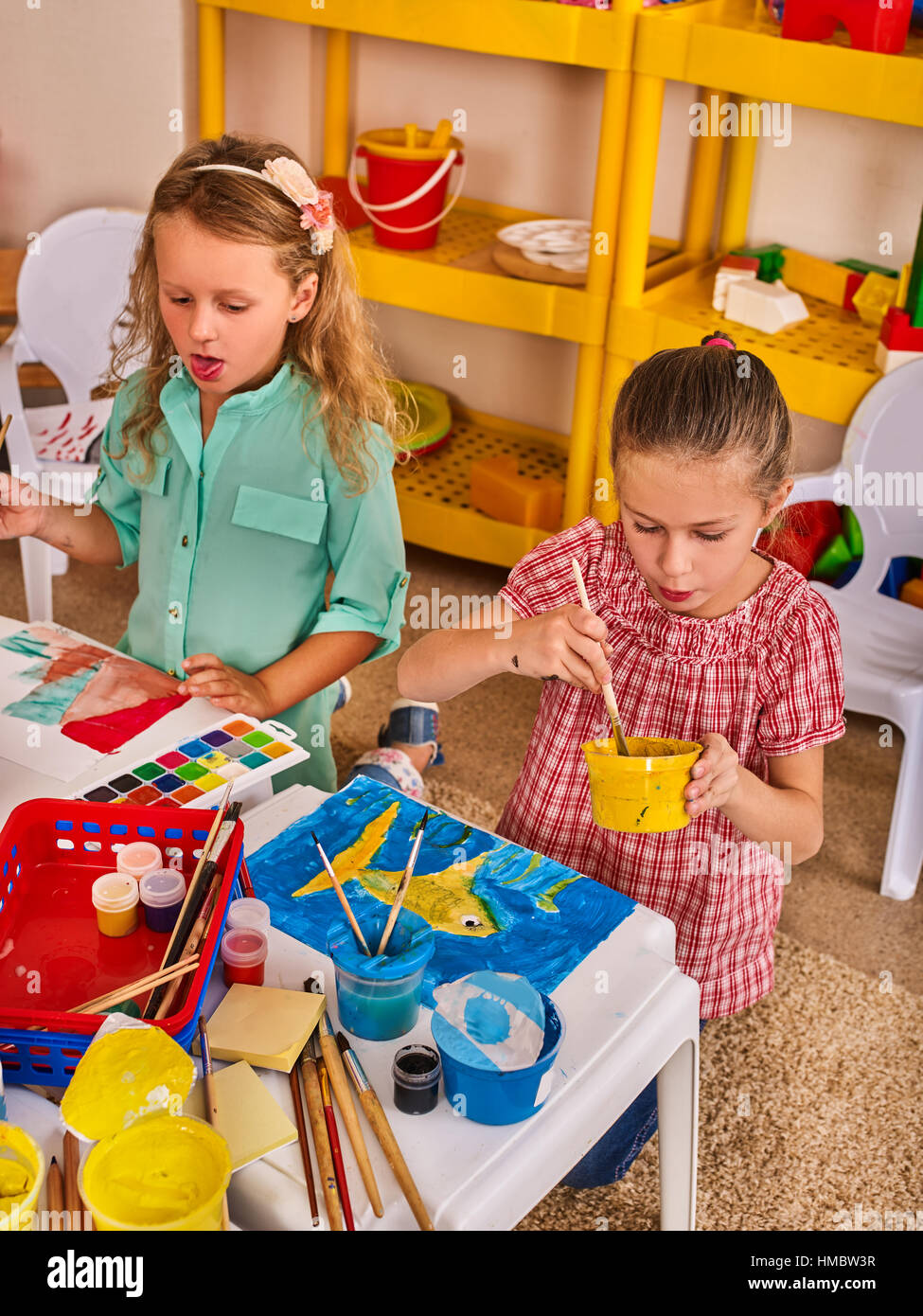 Small students children painting in art school class Stock Photo - Alamy