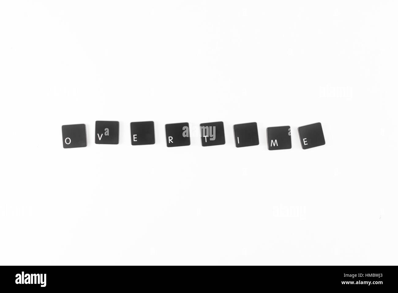 Overtime word written with black computer keyboard keys Stock Photo - Alamy