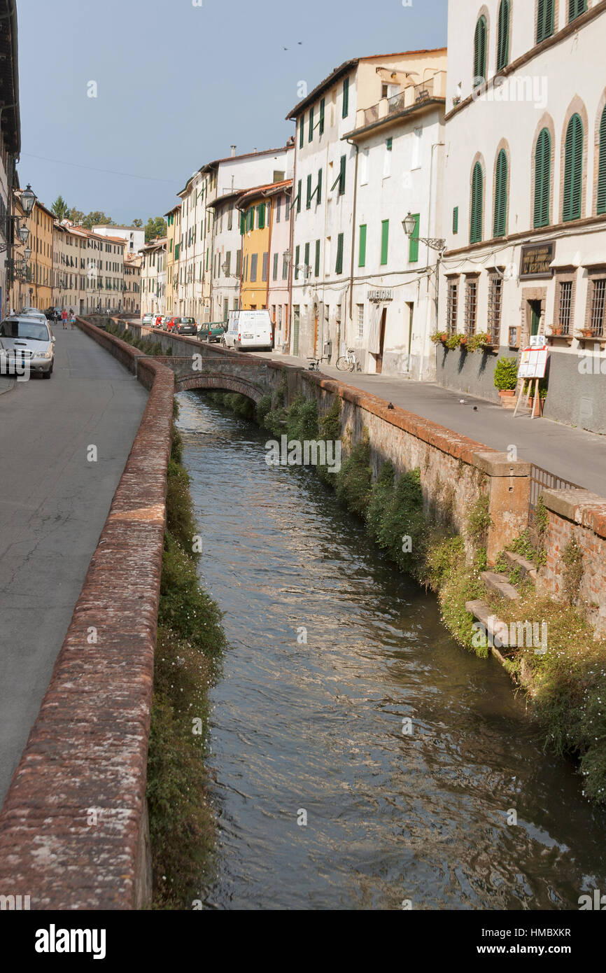 LUCCA, ITALY - SEPTEMBER 06, 2014: Unrecognizable people walk along ...