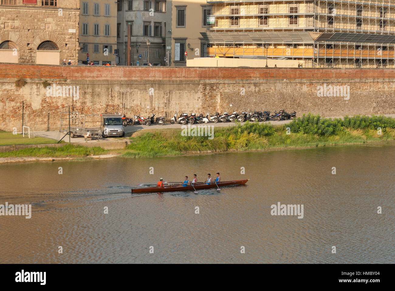 FLORENCE, ITALY - SEPTEMBER 09, 2014: Team of rowers train in a boat ...