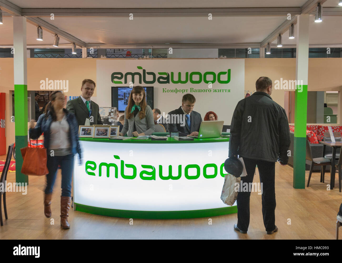 Visitors visit Embawood furniture company booth during Kiev ...