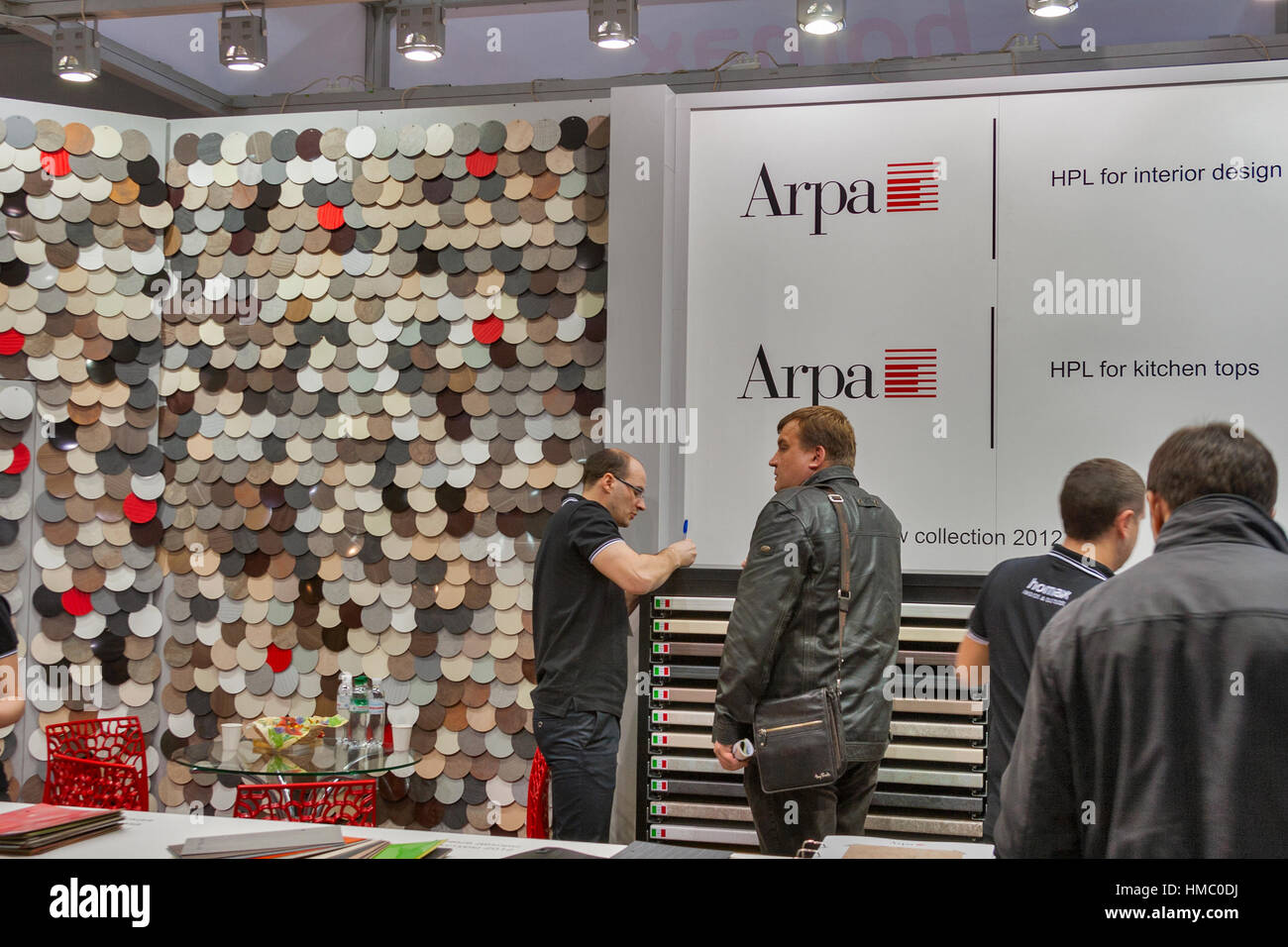 Visitors visit ARPA Italian company booth display at Kiev International ...