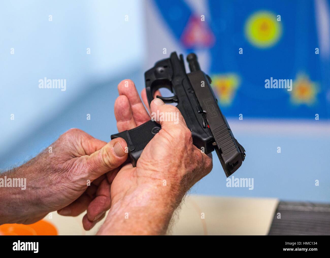 Shooting range. Loading a Ruger LC9 semi-automatic pistol Stock Photo ...