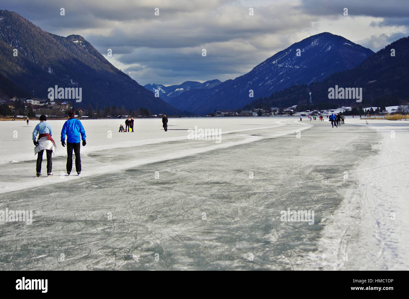 Ice skating on lake lake weissensee hi-res stock photography and images ...