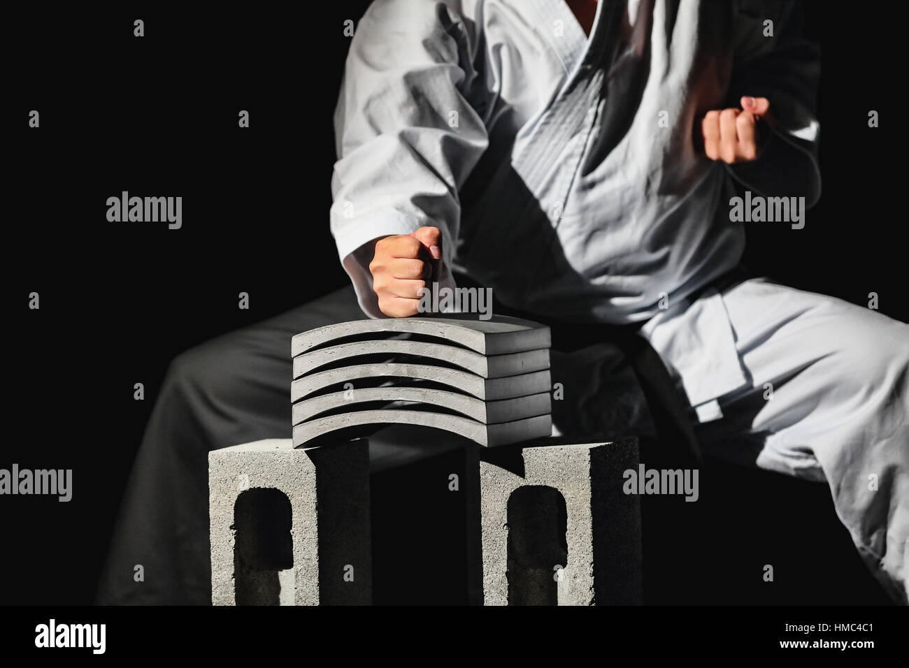Japanese karate master breaking tiles Stock Photo - Alamy