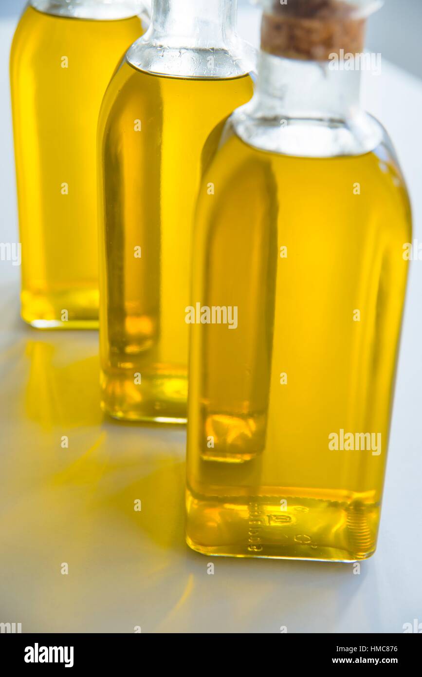 Three oil bottles. Close view Stock Photo - Alamy