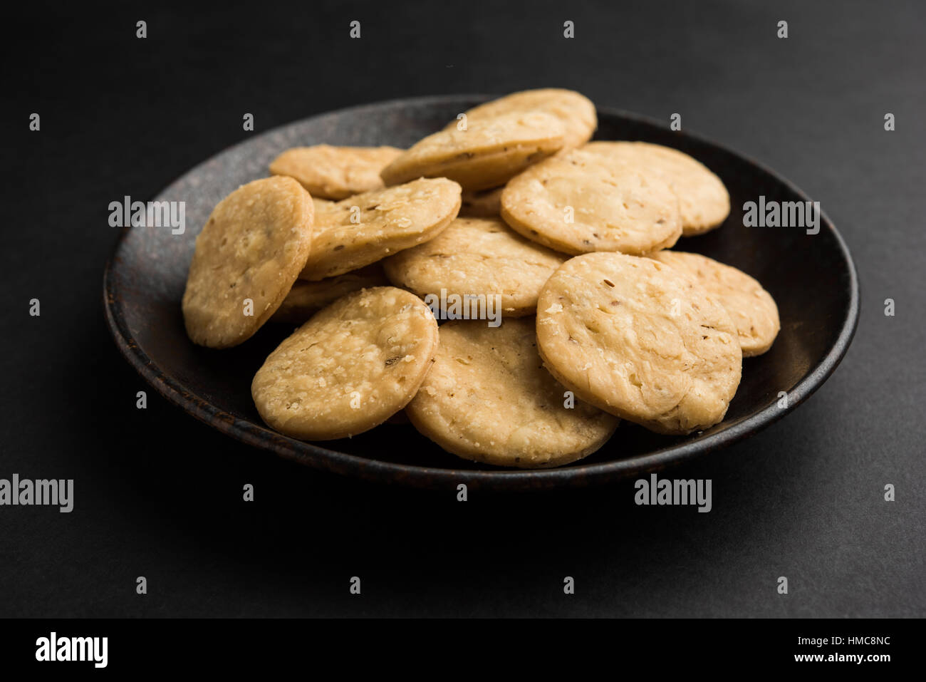 spicy fried mathri or mathari which is an indian snack served with a ...