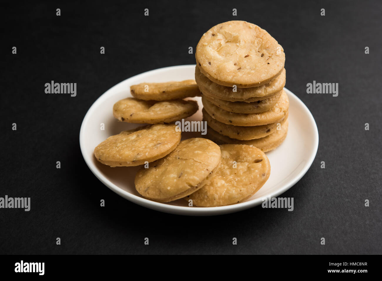 spicy fried mathri or mathari which is an indian snack served with a ...