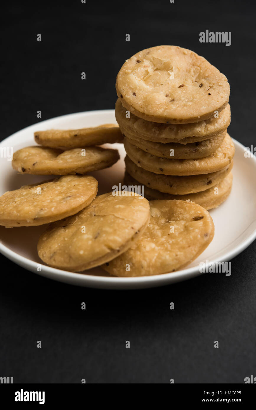 spicy fried mathri or mathari which is an indian snack served with a ...